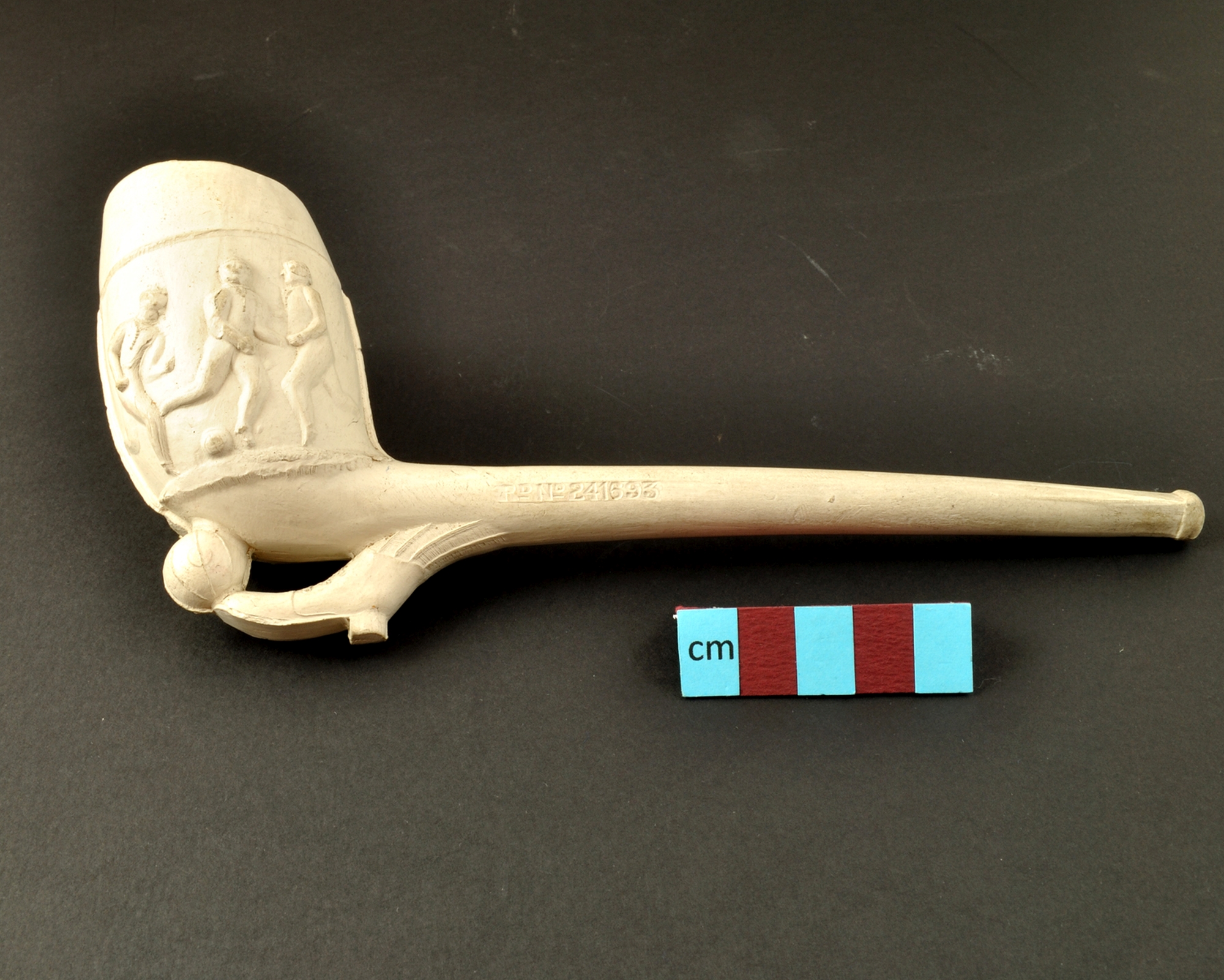 Catalogue record: Cadger clay pipe with bas relief football players ...